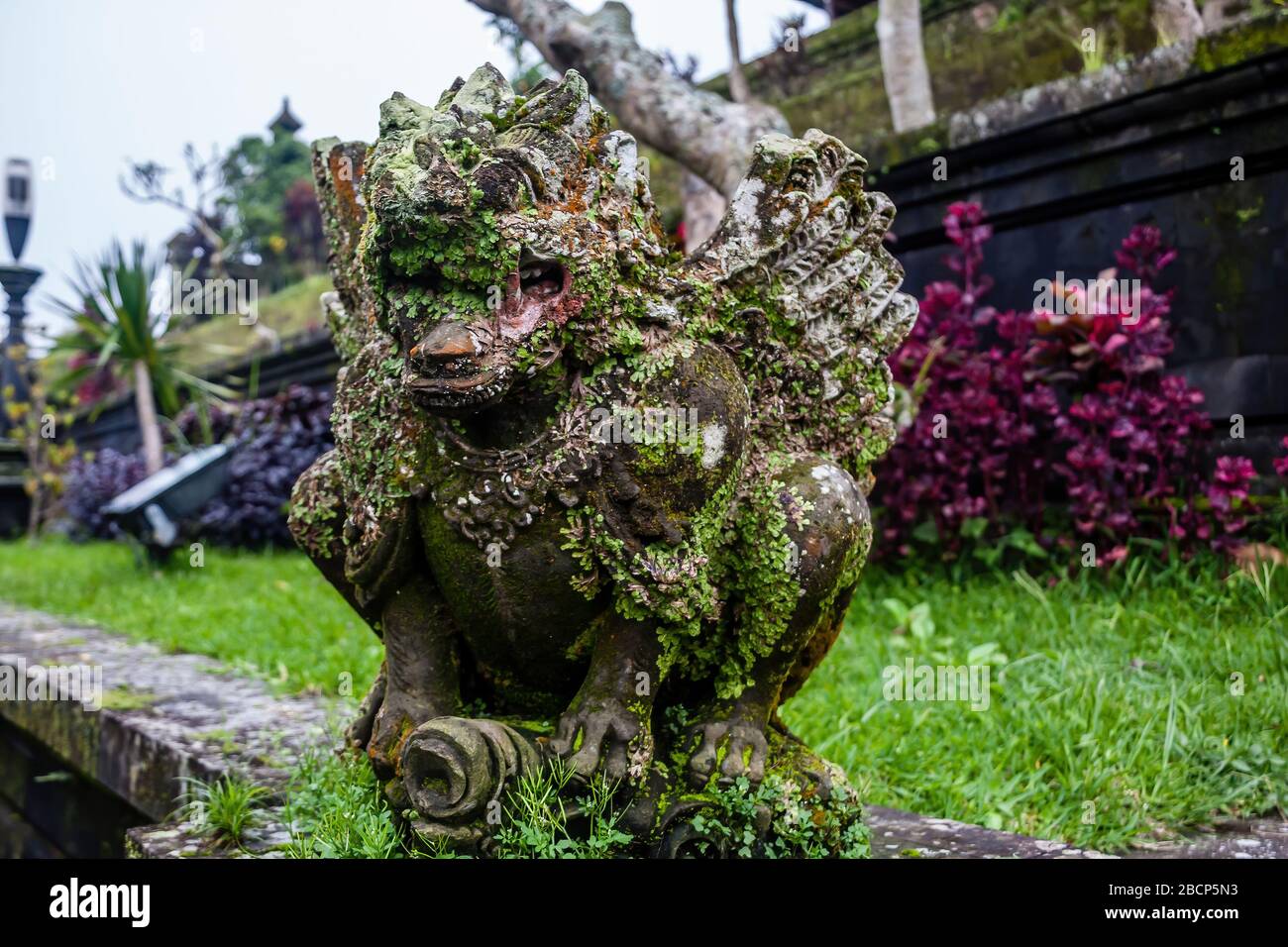 A sculpture of a mythological creature in Pura Besakih Temple, Bali ...