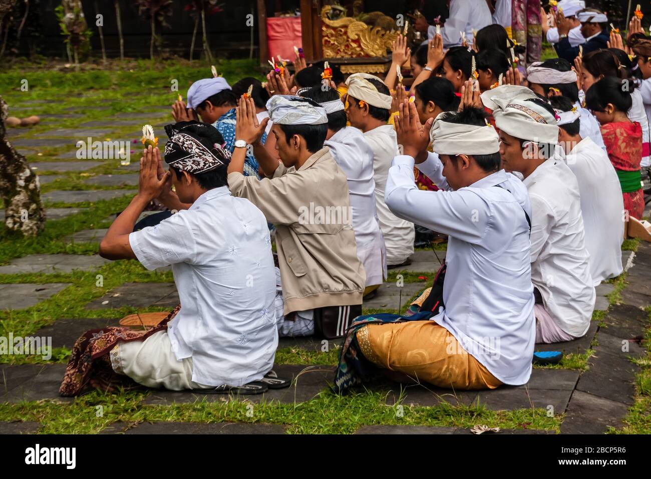 Balinese Hindu devotees praying during the religious ceremony Stock ...