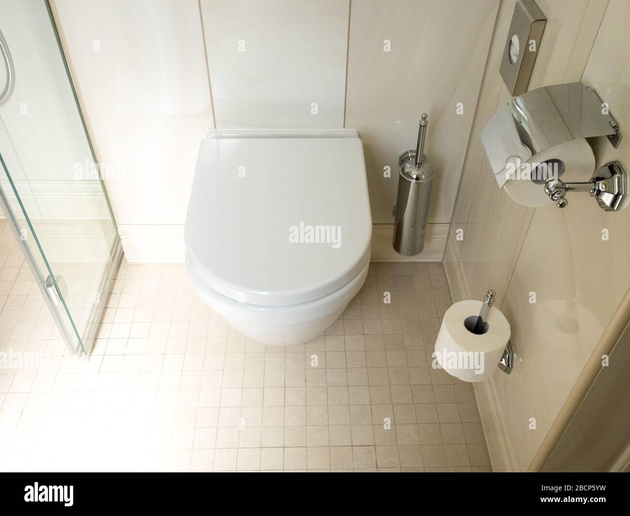 Modern interior of restroom with flush toilet, white toilet in the ...