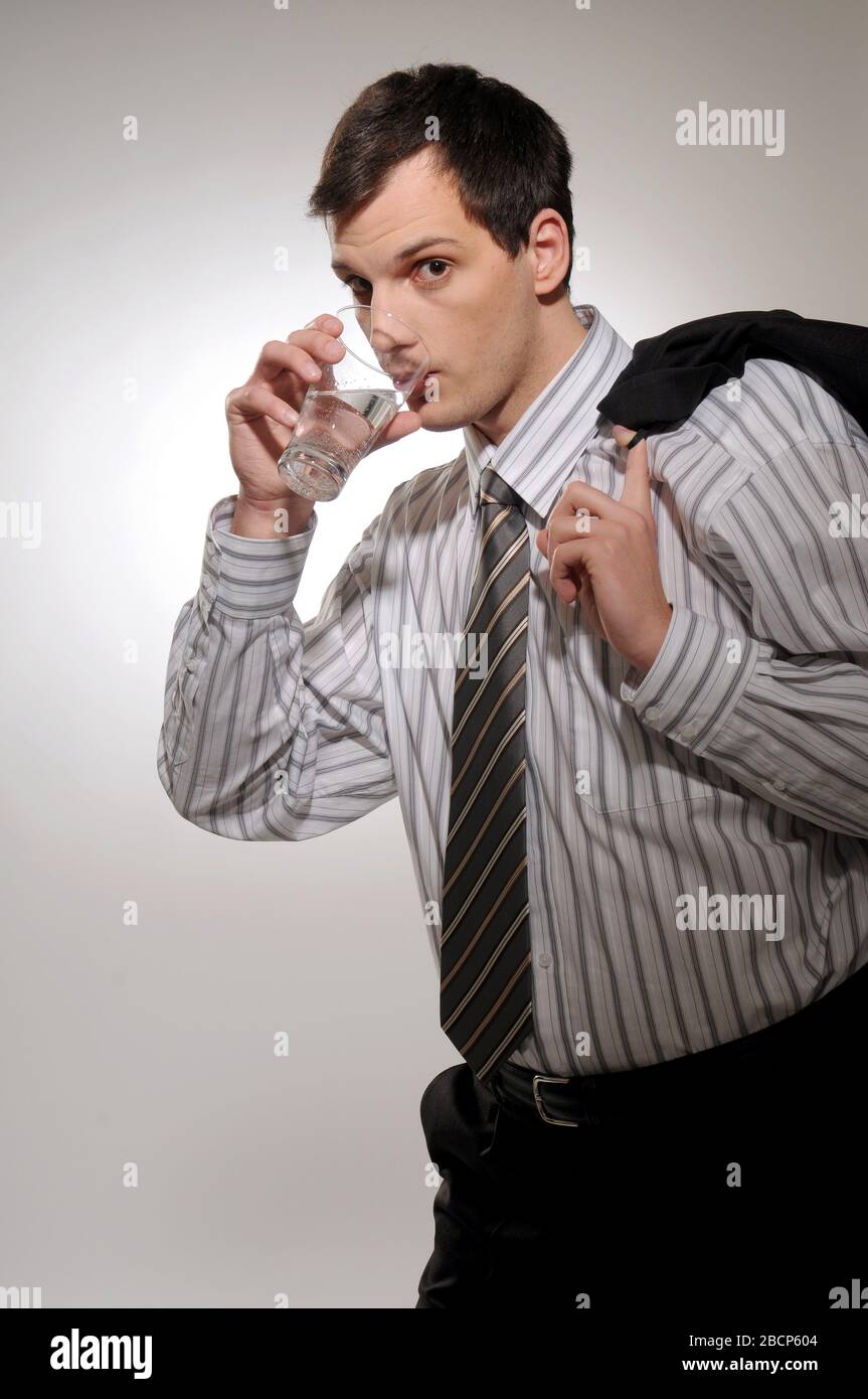 Young worried manager in striped shirt and tie Stock Photo - Alamy