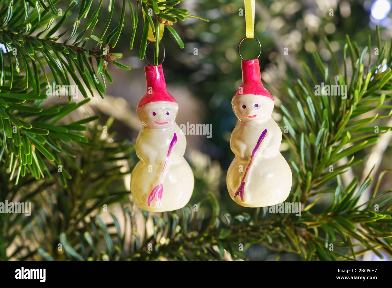 Two snowmen-new years Soviet glass Christmas tree toys on a branch of ...