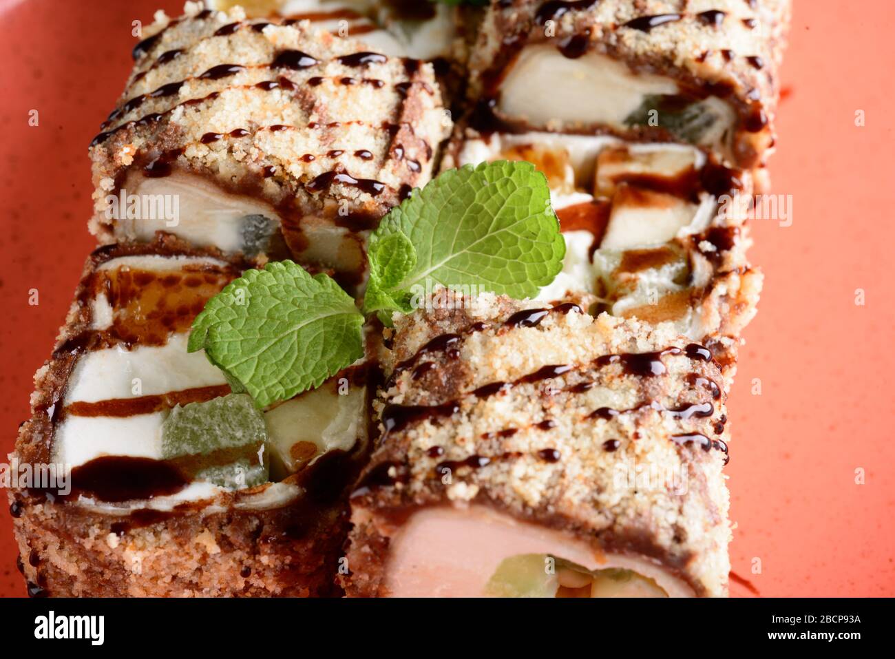 Dessert Maki sushi roll with various fruits and cream cheese inside ...