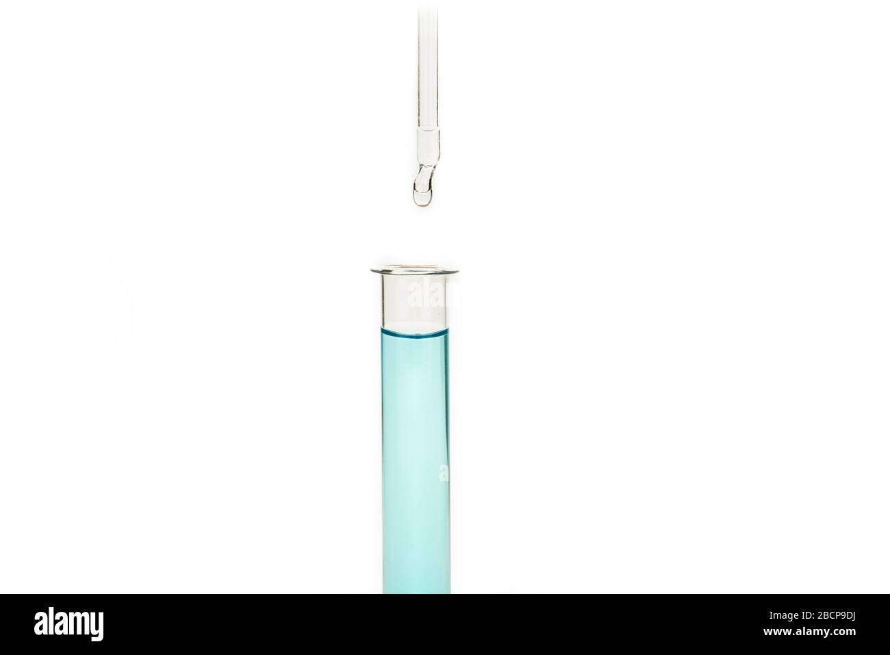 Dripping reagent into test tube with liquid sample Stock Photo - Alamy