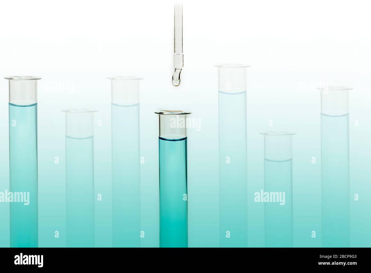 Dripping reagent into test tube with liquid sample Stock Photo - Alamy