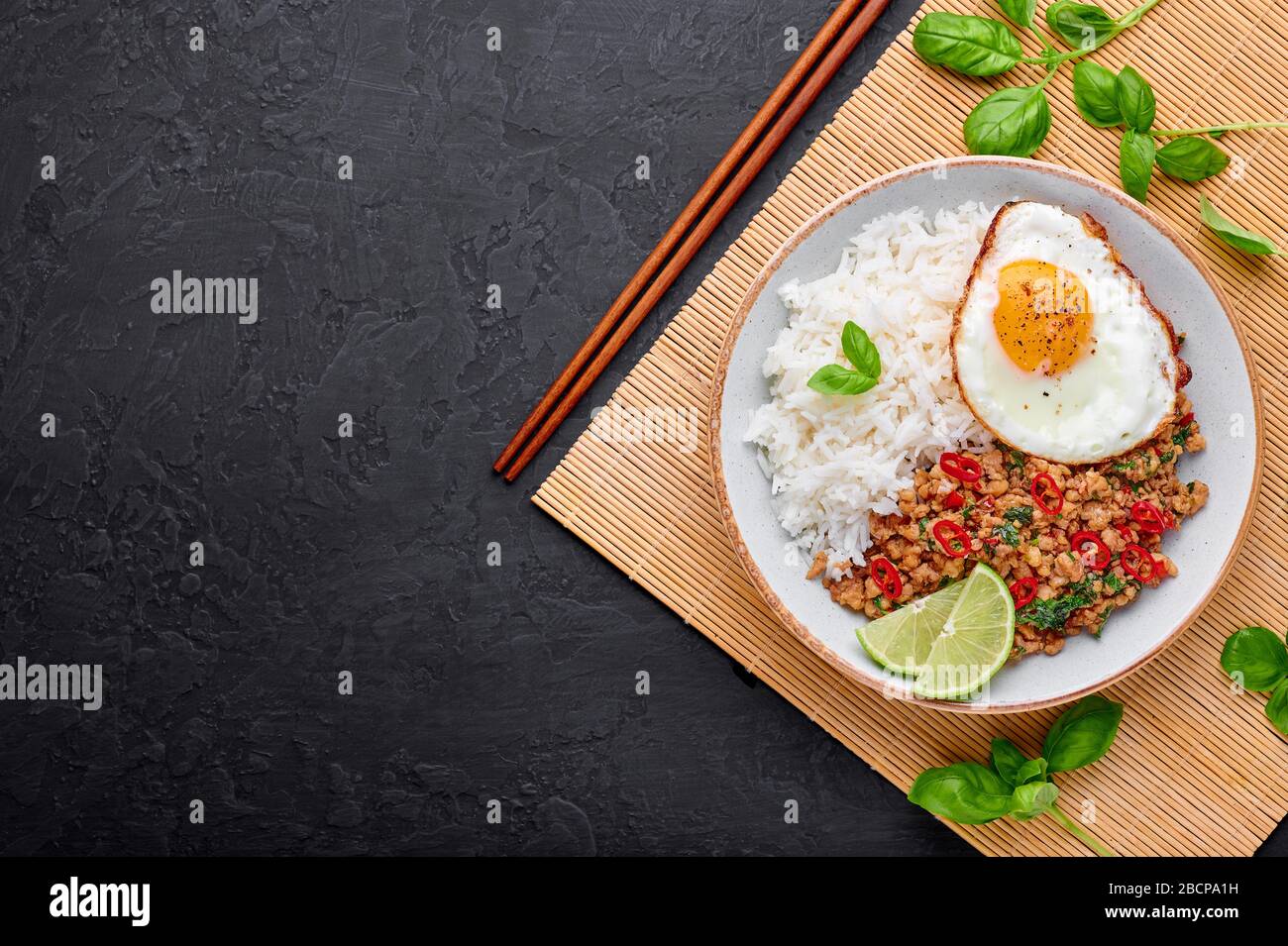 Pad Krapow Gai - Thai Basil Chicken with Rice and fried Egg black slate ...