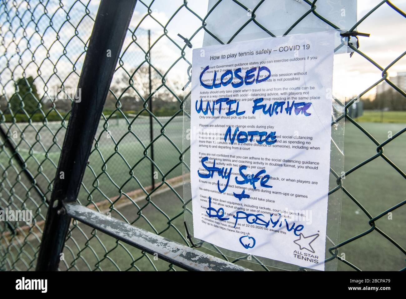 A sign on a tennis club hut warns of the importance of not entering ...