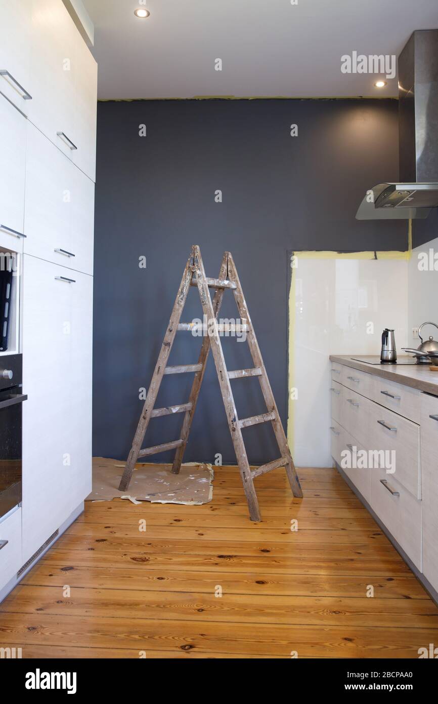 renovation concept - ladder in kitchen room during restoration or ...