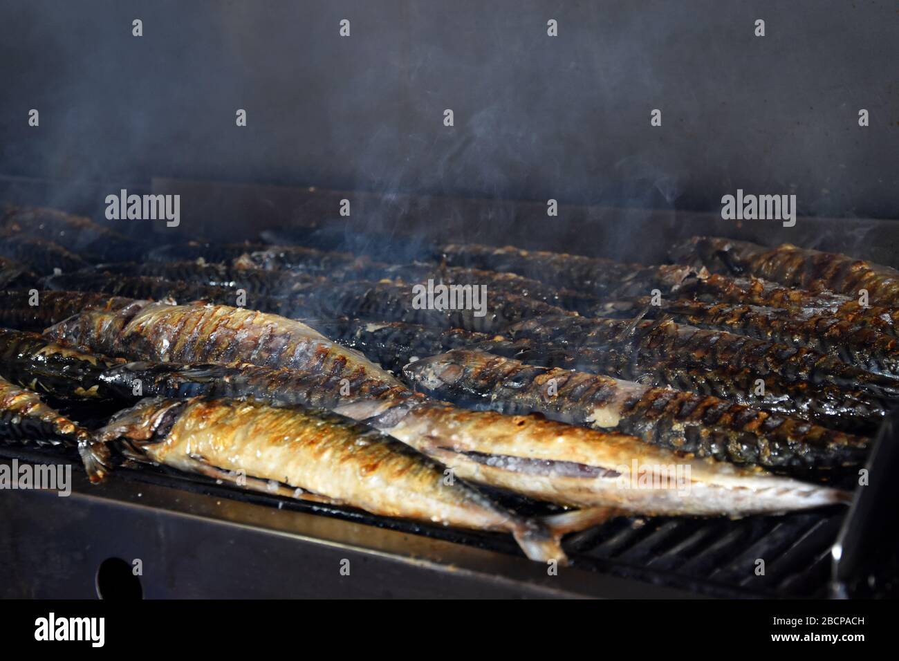Photo of grilled golden fish. Cooking fresh fish on the boat Stock ...
