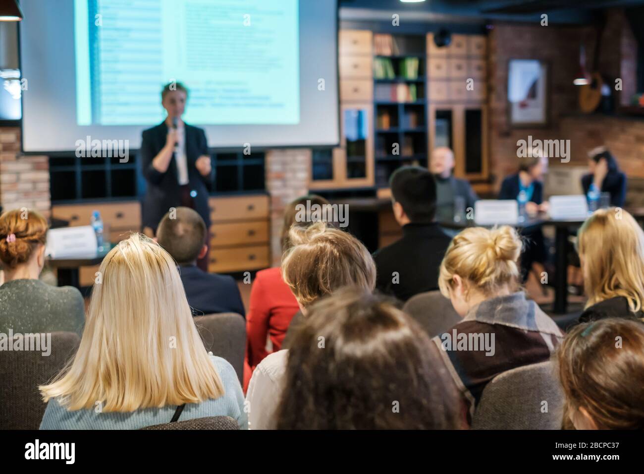 Audience listens lecturer at workshop in conference hall Stock Photo ...