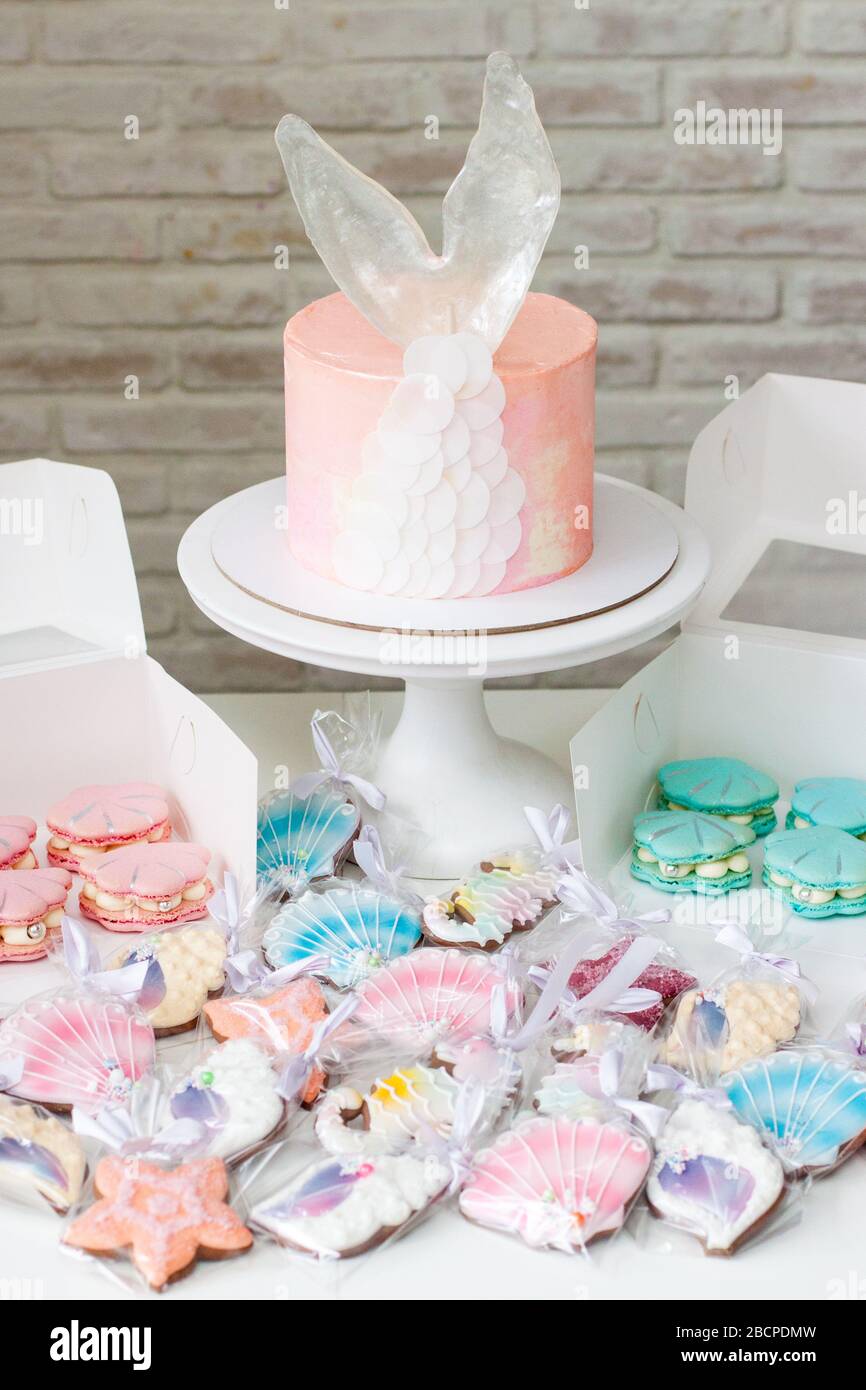 Mermaid theme candy bar with cake, cupcakes, macaroons and biscuits ...