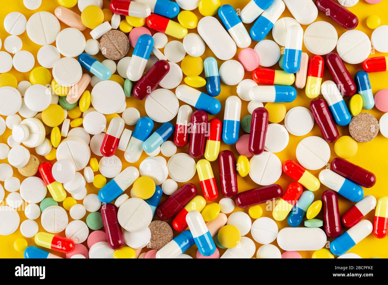 A lot of colorful medication and pills from above. Pharmaceutical ...