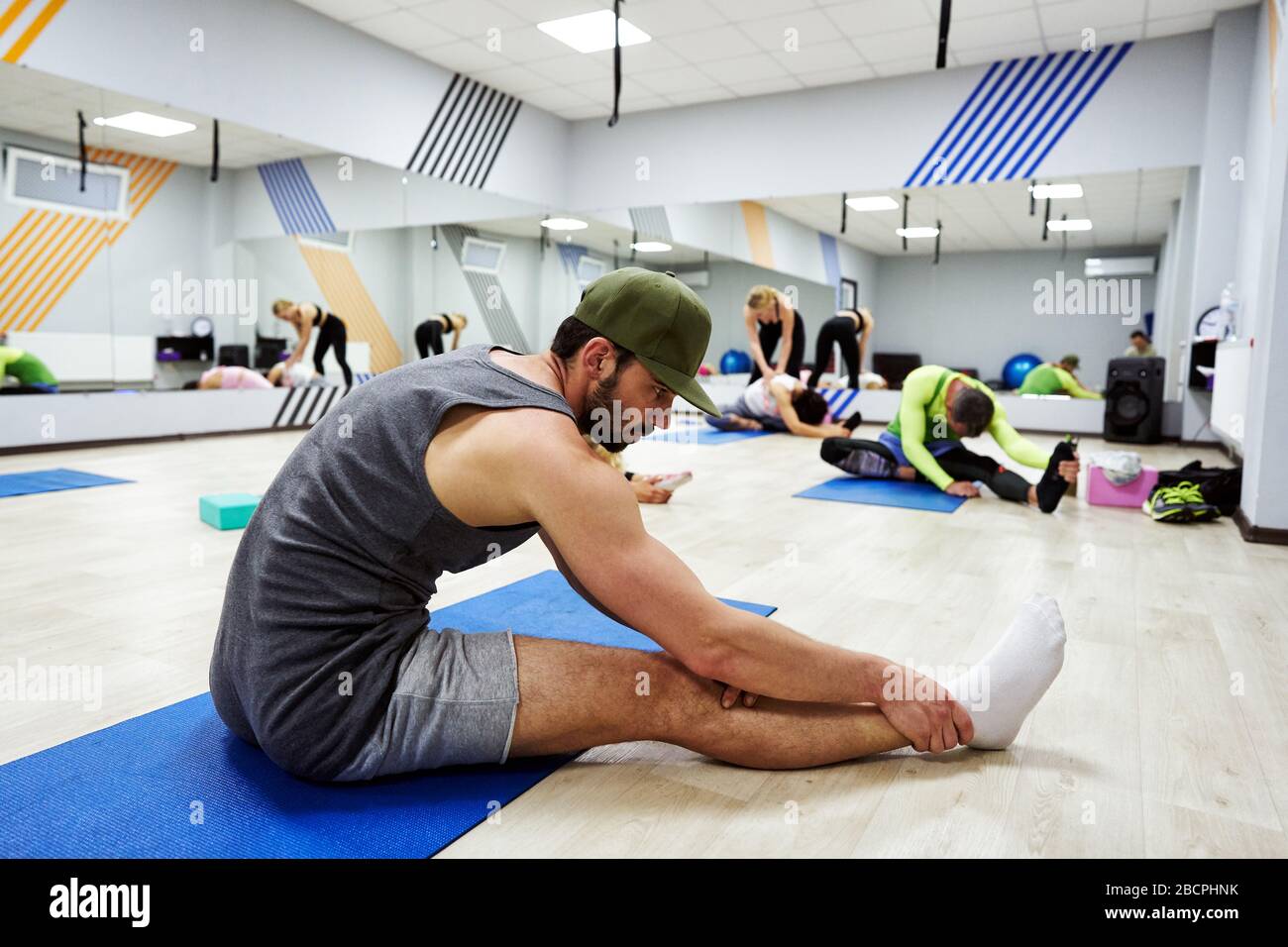 Real training of a group of people in a fitness center. The man in the ...