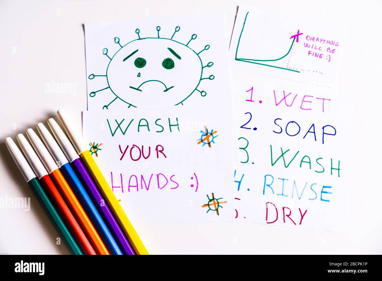 Drawings made by a child of positive messages for the coronavirus with ...