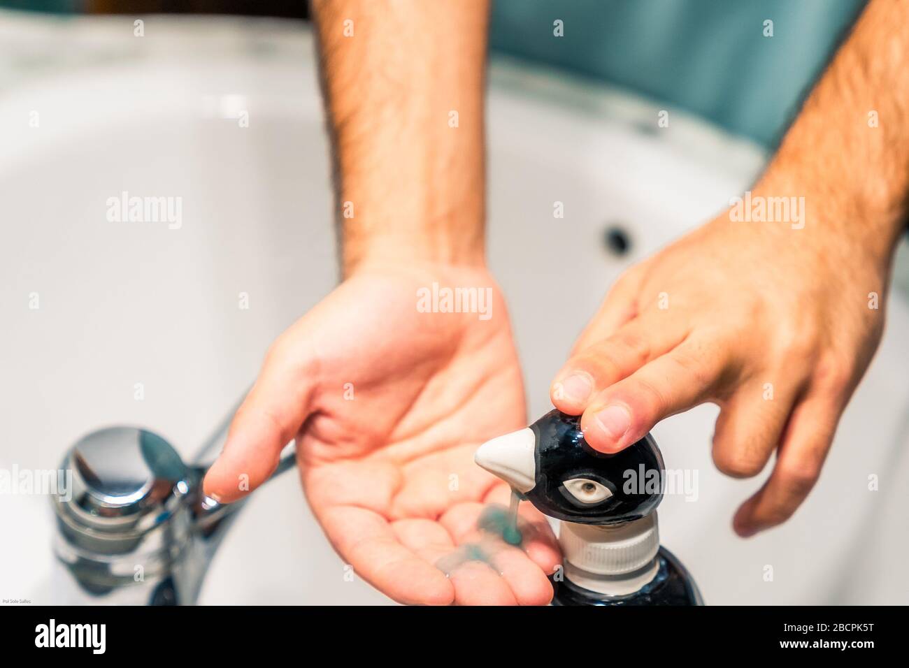Using disinfectant soap to properly wash your hands to prevent the ...