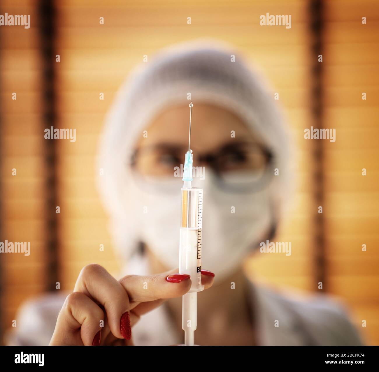Picture of a nurse preparing a vaccine injection Stock Photo - Alamy