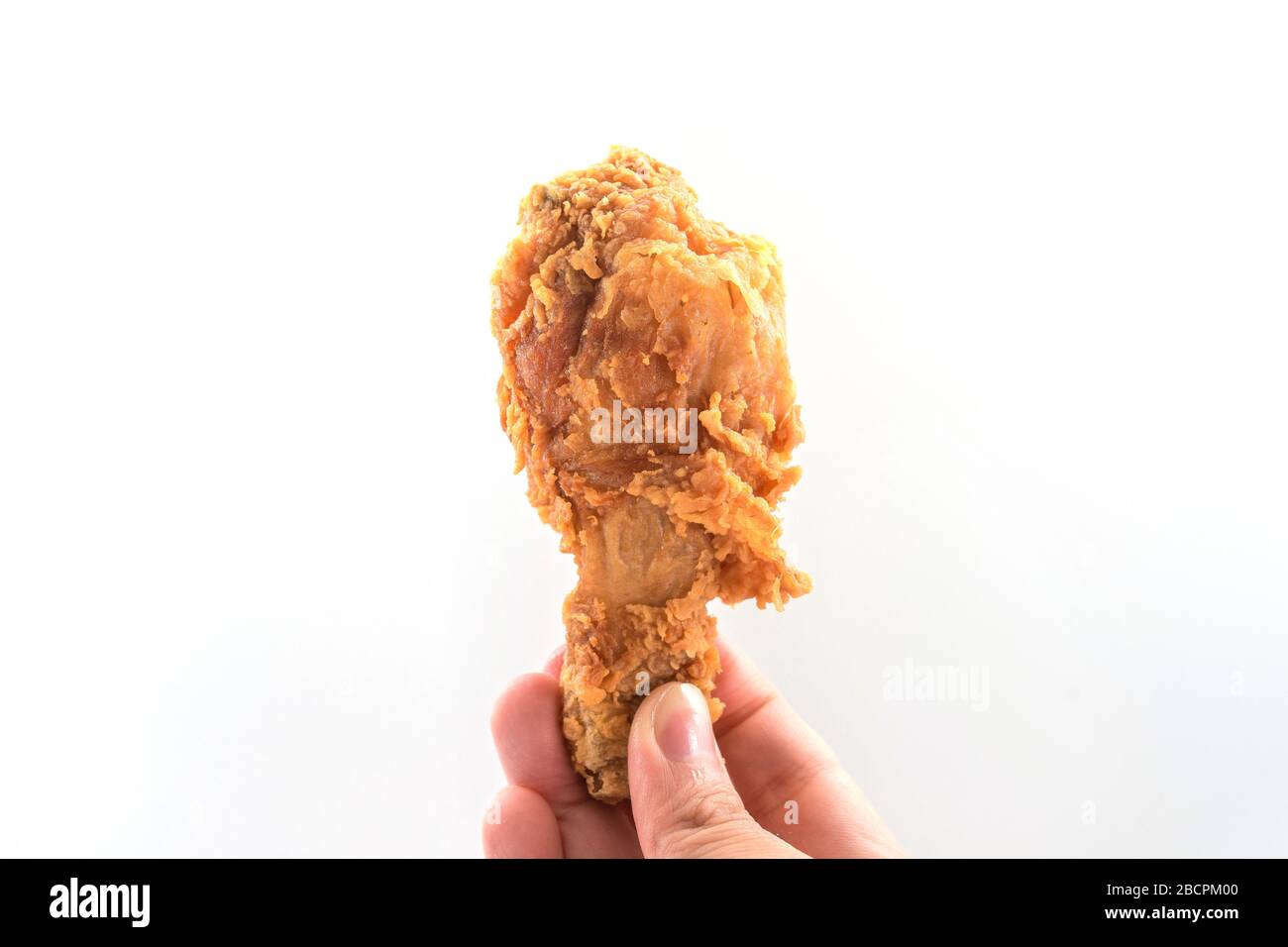 Hand hold fried chicken isolated on white Stock Photo - Alamy