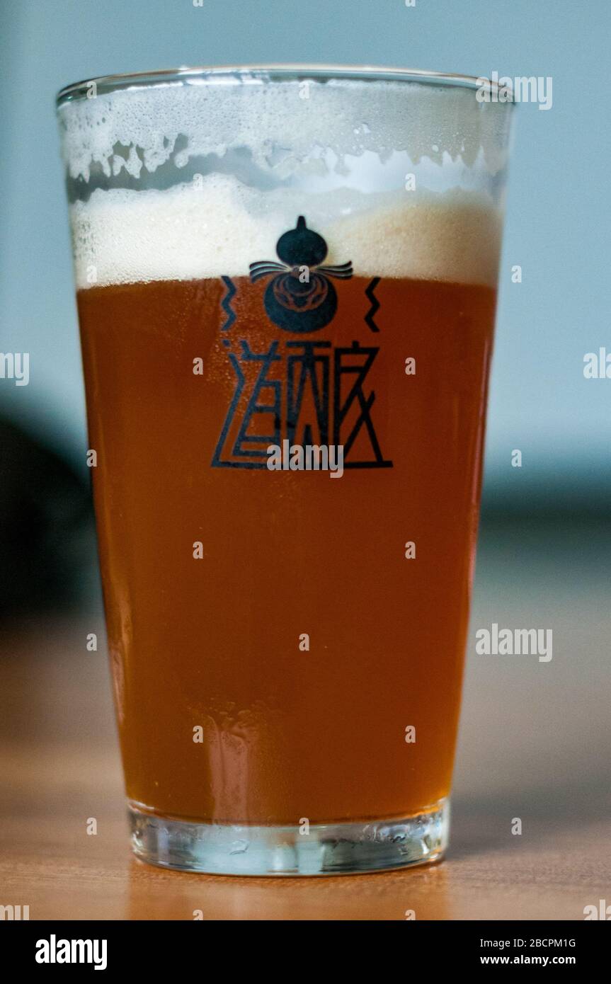 A cool glass of Chengdu's Harvest Brewery's IPA Stock Photo - Alamy