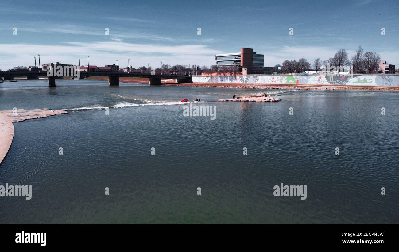 People surfing the rapids in downtown Dayton. Riverscape surfers ...