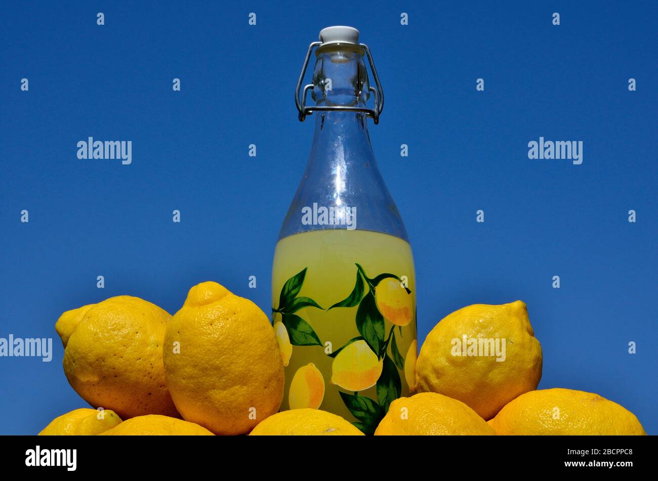 Lemonade bottlewith blue sky background Stock Photo - Alamy