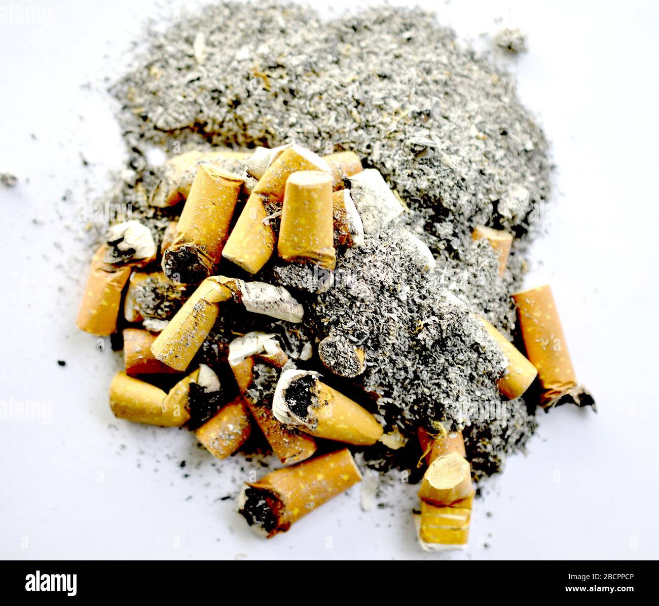 cigarette buts on white background, bad habit concept Stock Photo - Alamy