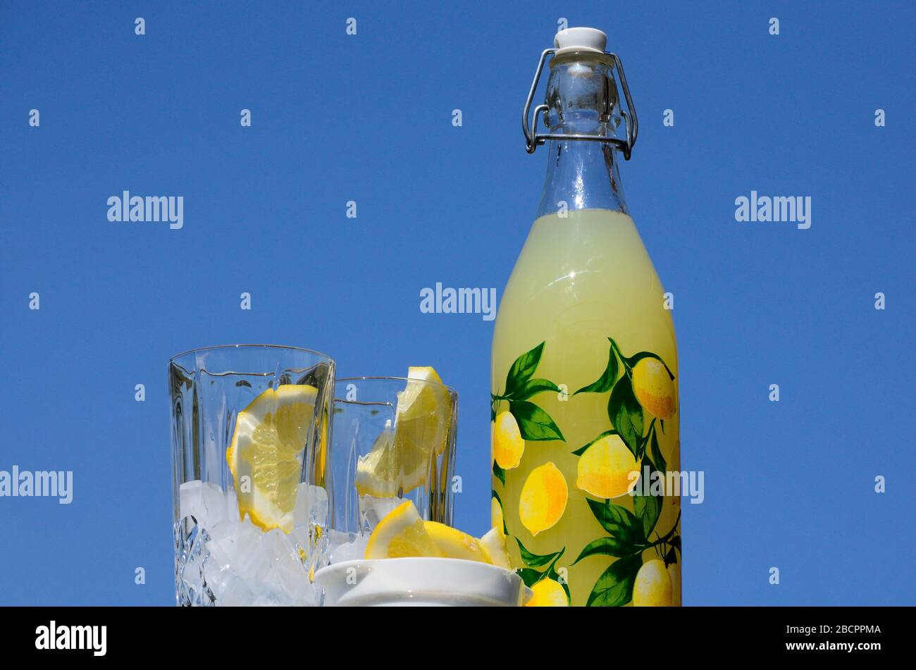 Lemonade bottlewith blue sky background Stock Photo - Alamy