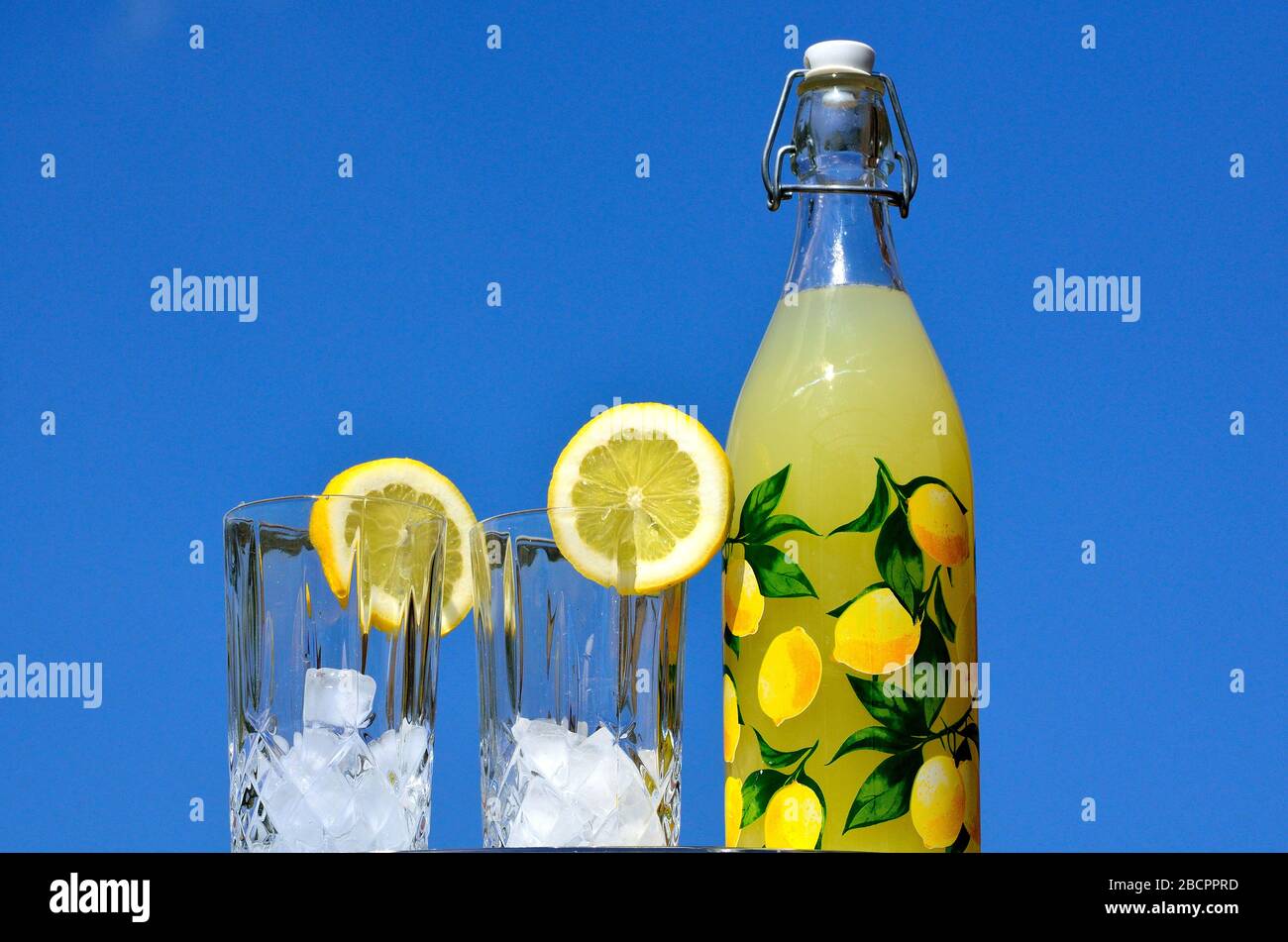 Lemonade bottlewith blue sky background Stock Photo - Alamy