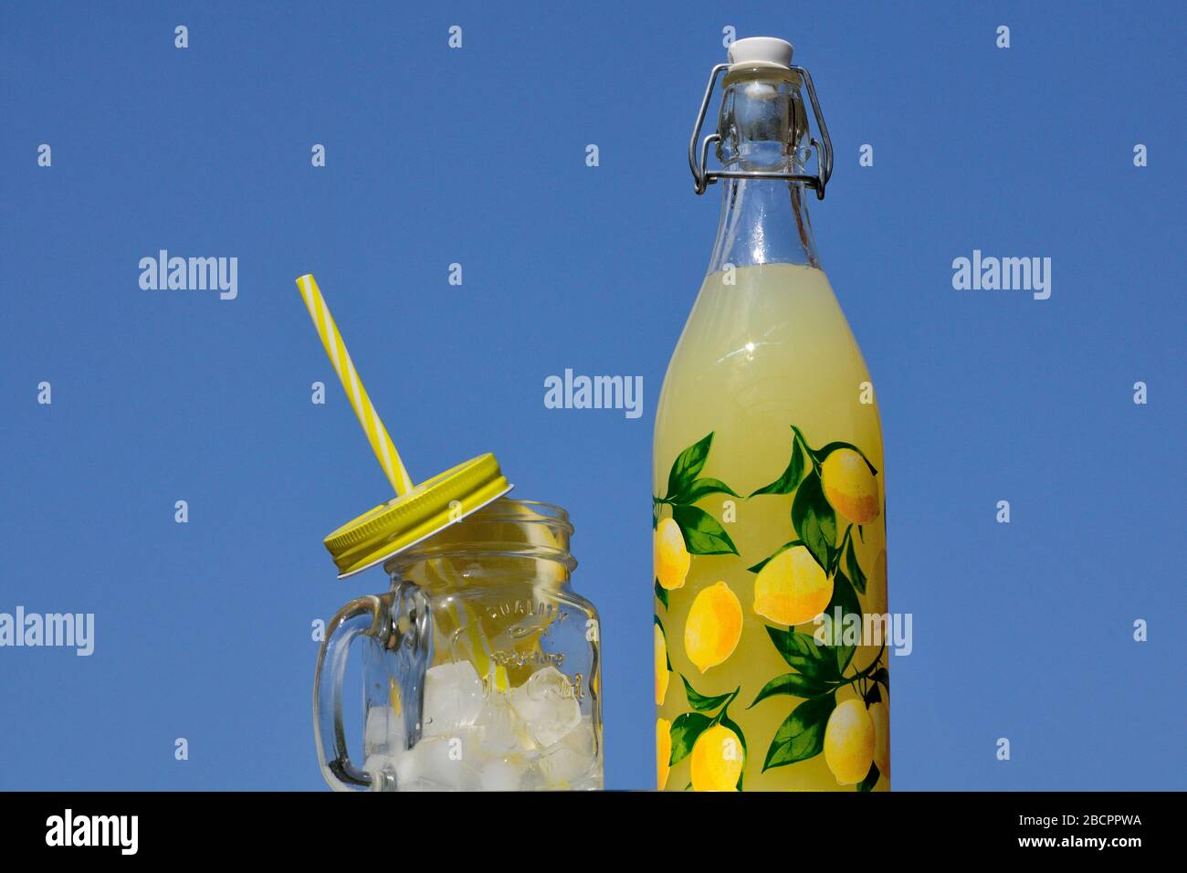 Lemonade bottlewith blue sky background Stock Photo - Alamy