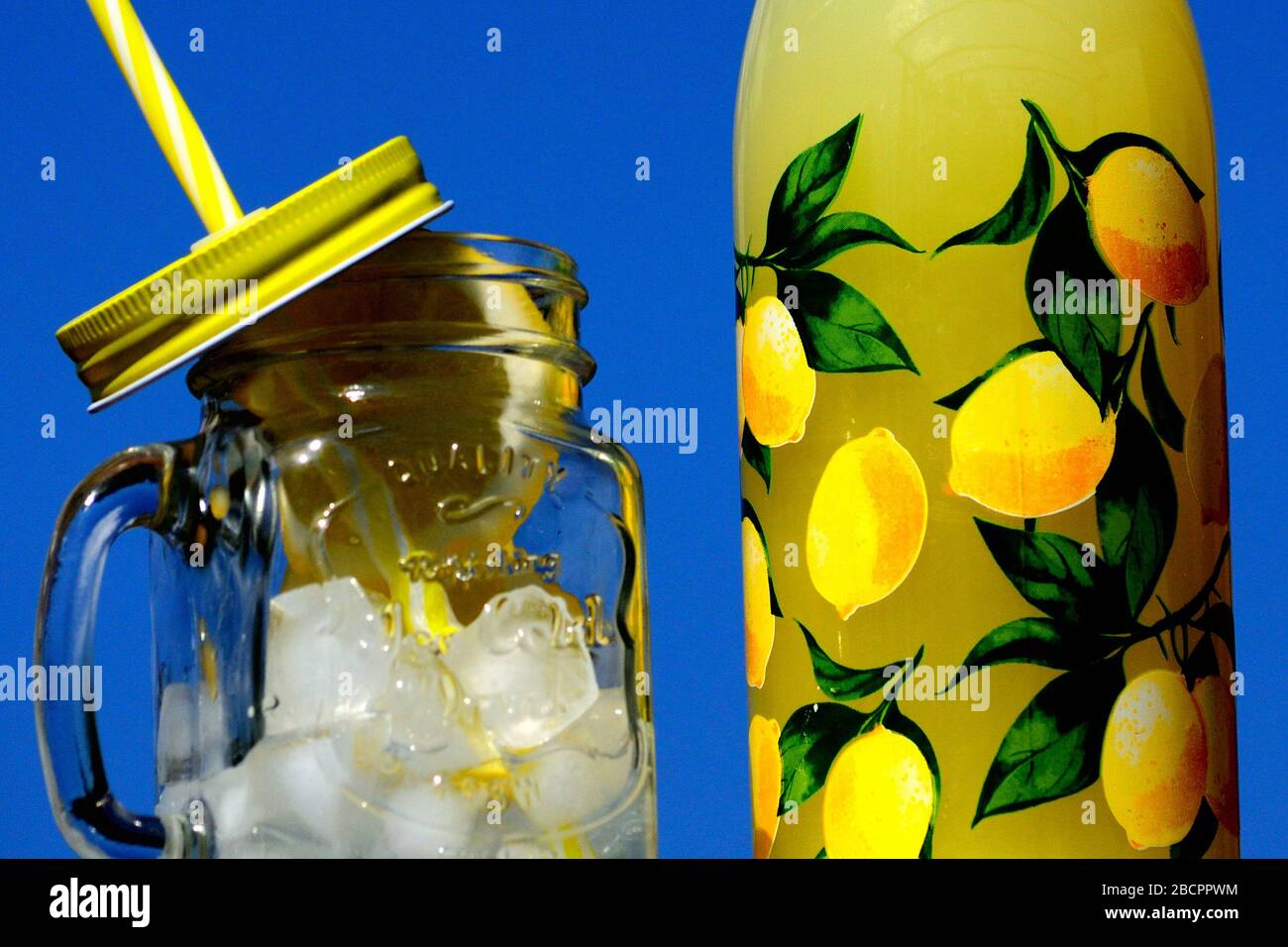 Lemonade bottlewith blue sky background Stock Photo - Alamy