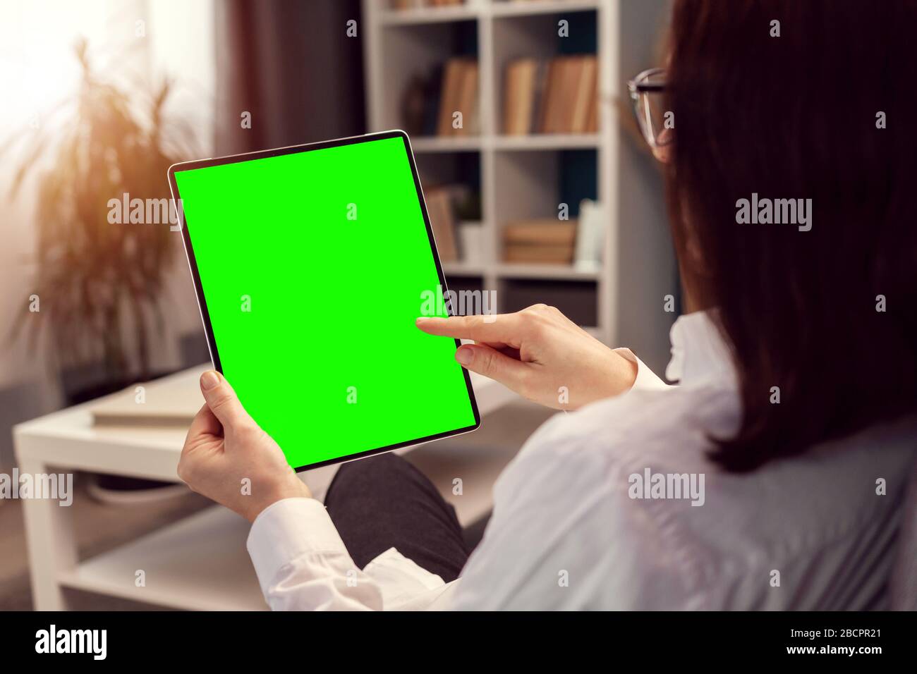 Woman touching tablet green screen Stock Photo - Alamy Woman touching tablet green screen Stock Photo - Alamy