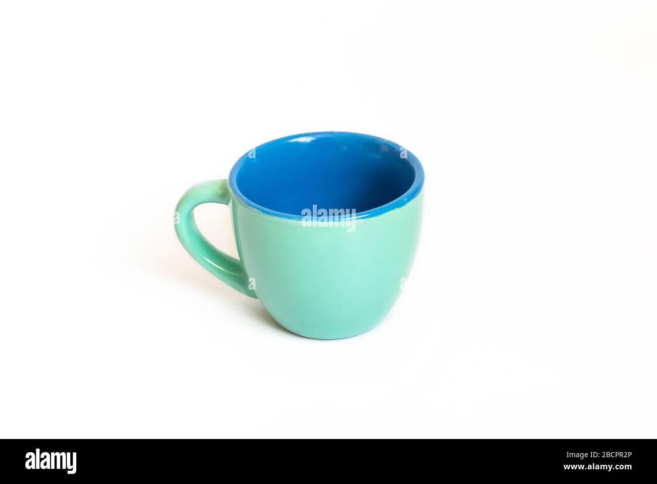 Little empty ceramic turquoise and blue coffee mug , coffee cup ...