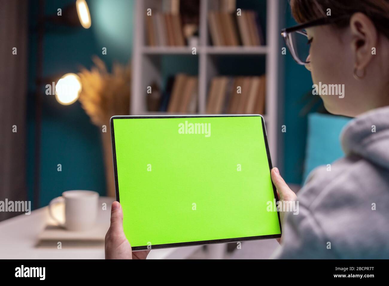 Female holding vertical tablet Stock Photo - Alamy