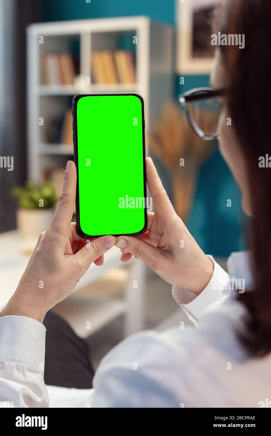 Woman hands vertically holding cellphone Stock Photo - Alamy