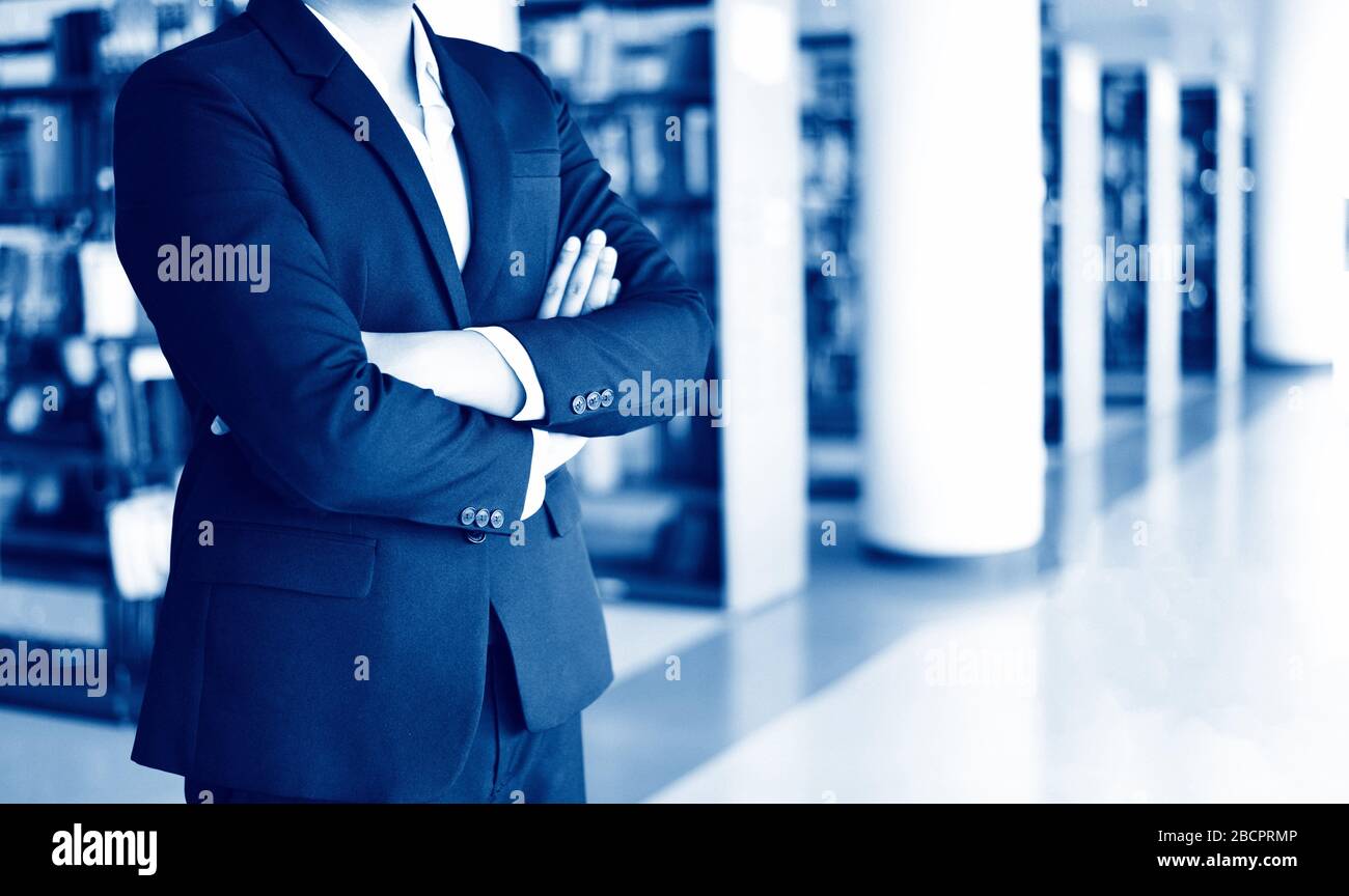 businessman standing in a office / smart business man or student ...