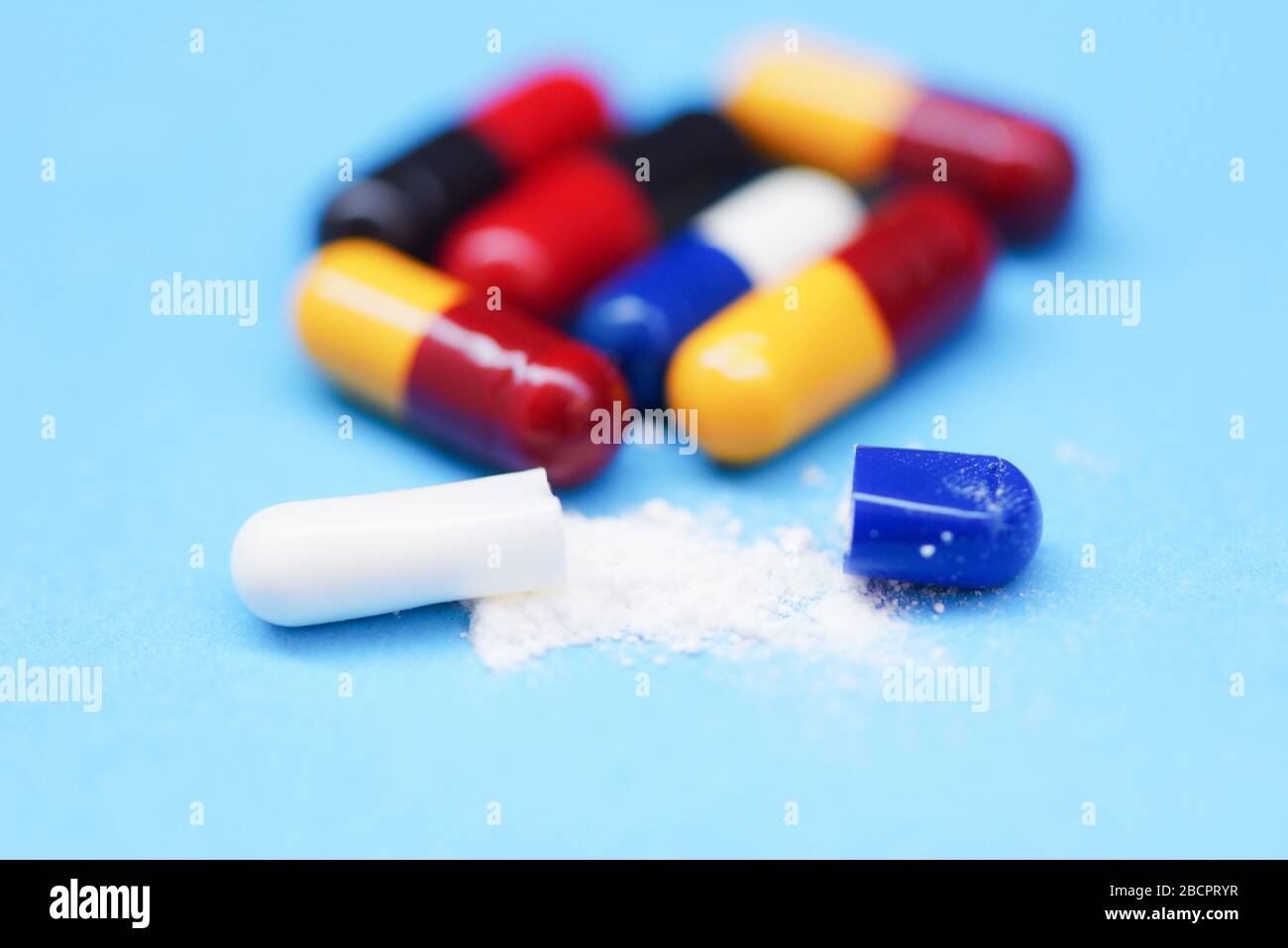 Many colorful assorted pharmaceutical medicine pills capsule drugs ...