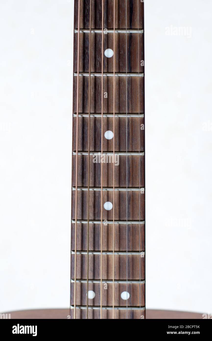 Close-up neck of guitar on a white background Stock Photo - Alamy