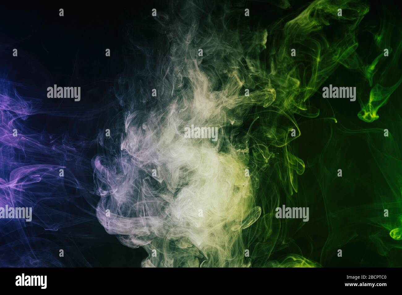 Pattern, Neon green and blue smoke in the on a dark isolated background ...