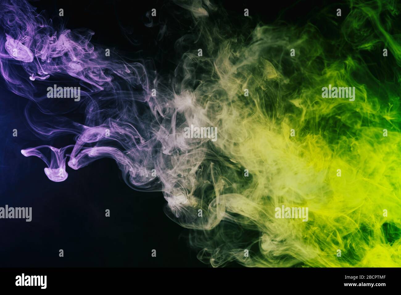 Pattern, Neon green and blue smoke in the on a dark isolated background ...