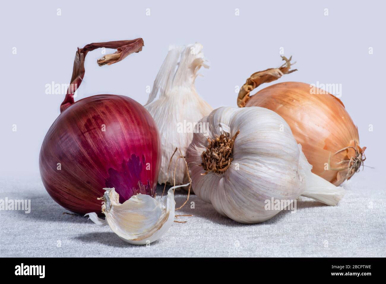 Close Up Of Clove Of Garlic With Onions High Resolution Stock ...