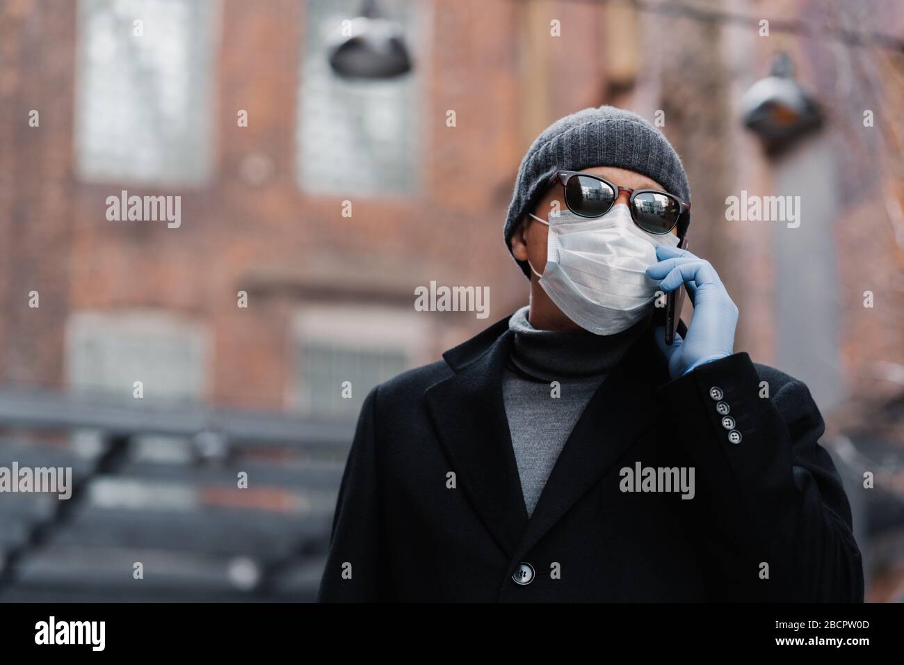 Sick man wears protective mask on face during virus pandemic, has ...