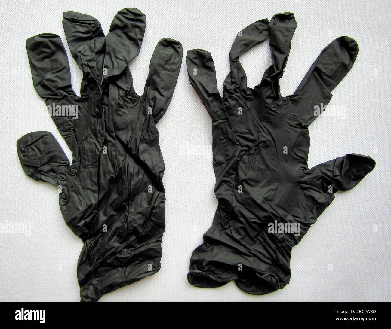 Black disposable gloves hi-res stock photography and images - Alamy