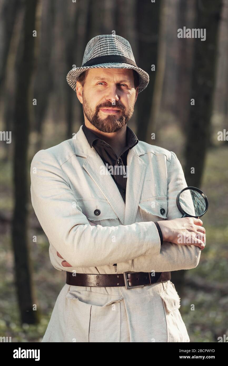 Positive man standing in forest Stock Photo - Alamy