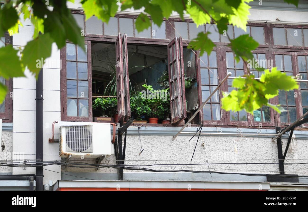 an open window in a residential building in the French concession in ...