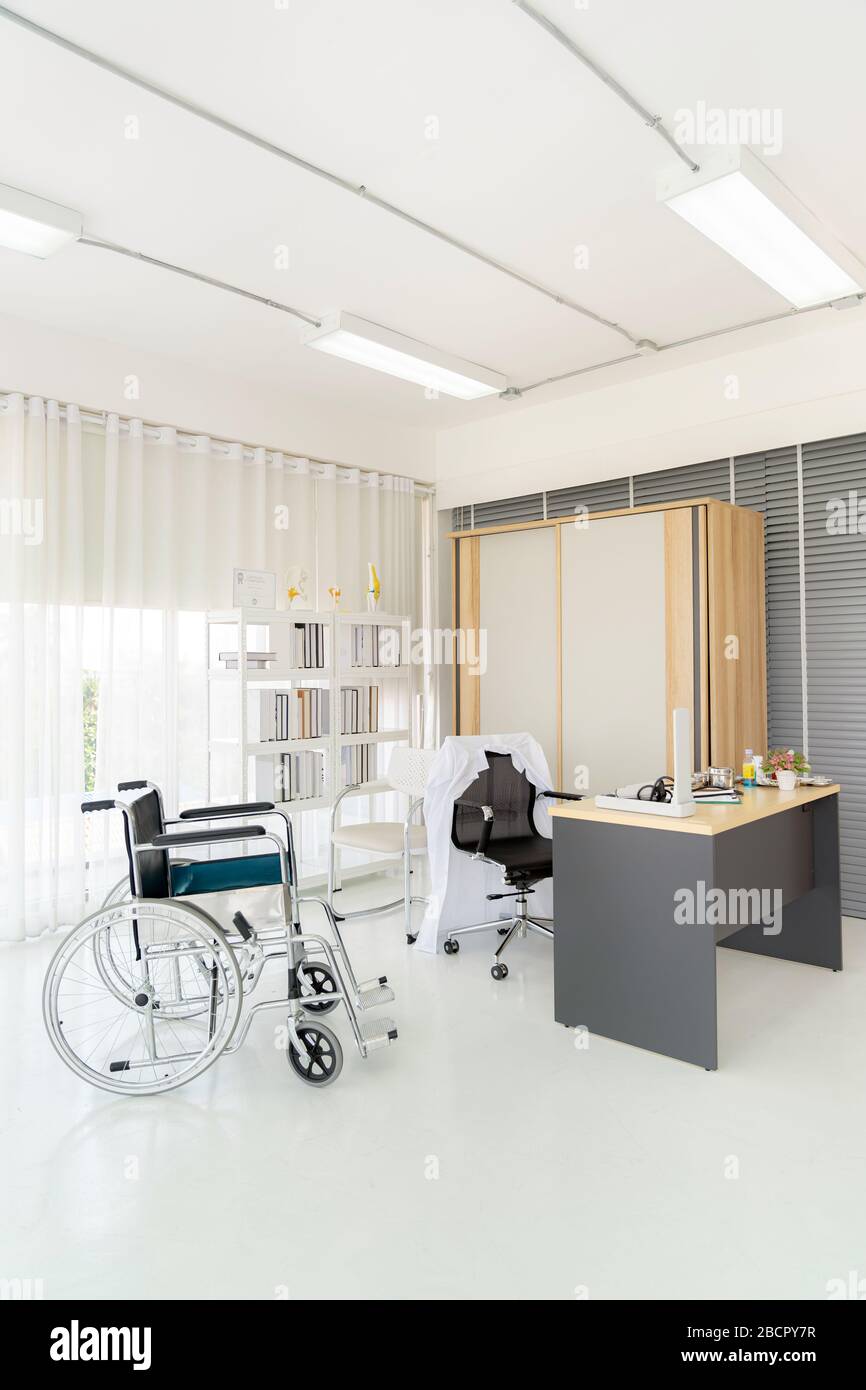 Interior of empty doctor office examination room workplace with ...