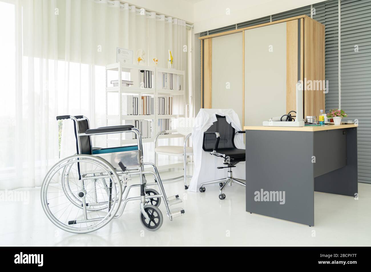 Interior of empty doctor office examination room workplace with ...
