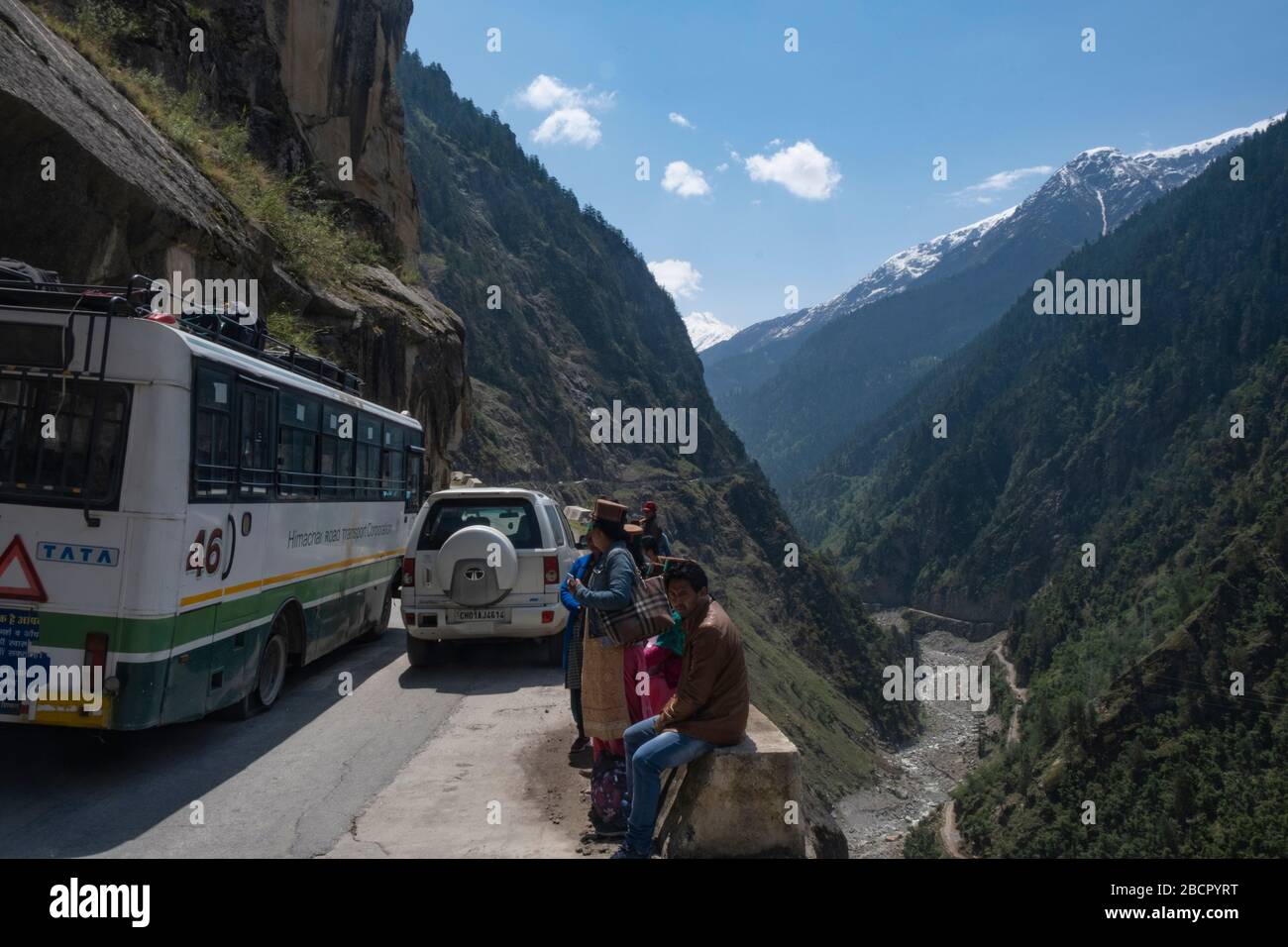 Passengers await for the next bus due to the breakdown of their bus on ...
