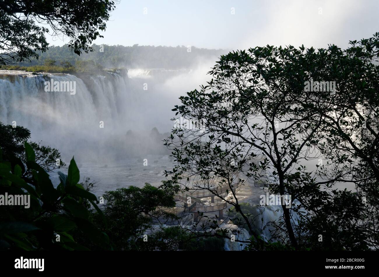 Sunrays passing through the spray over Iguacu Falls, the waterfalls ...