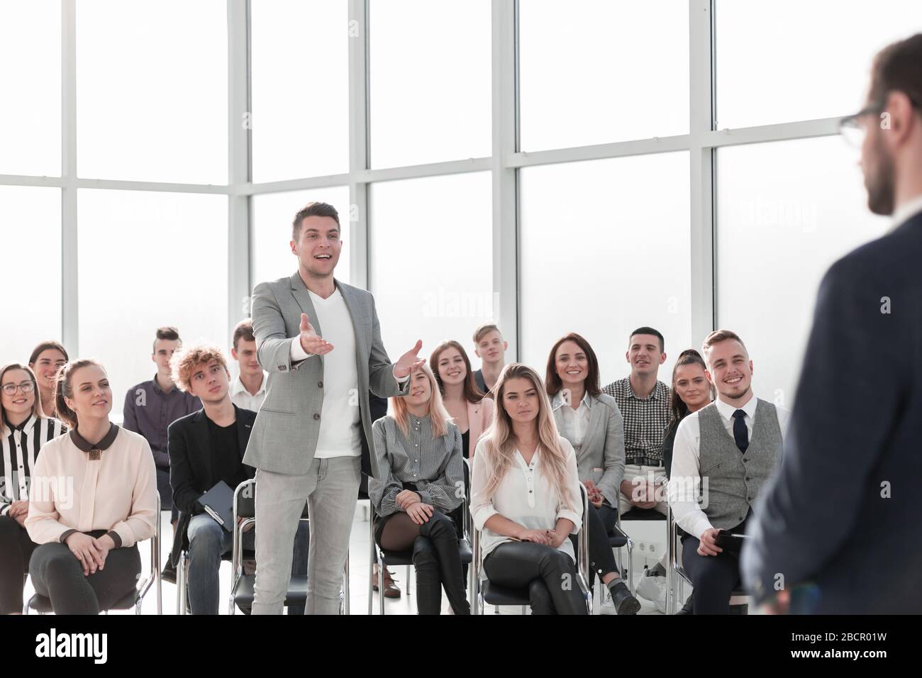 Audience answering questions speaker hi-res stock photography and ...