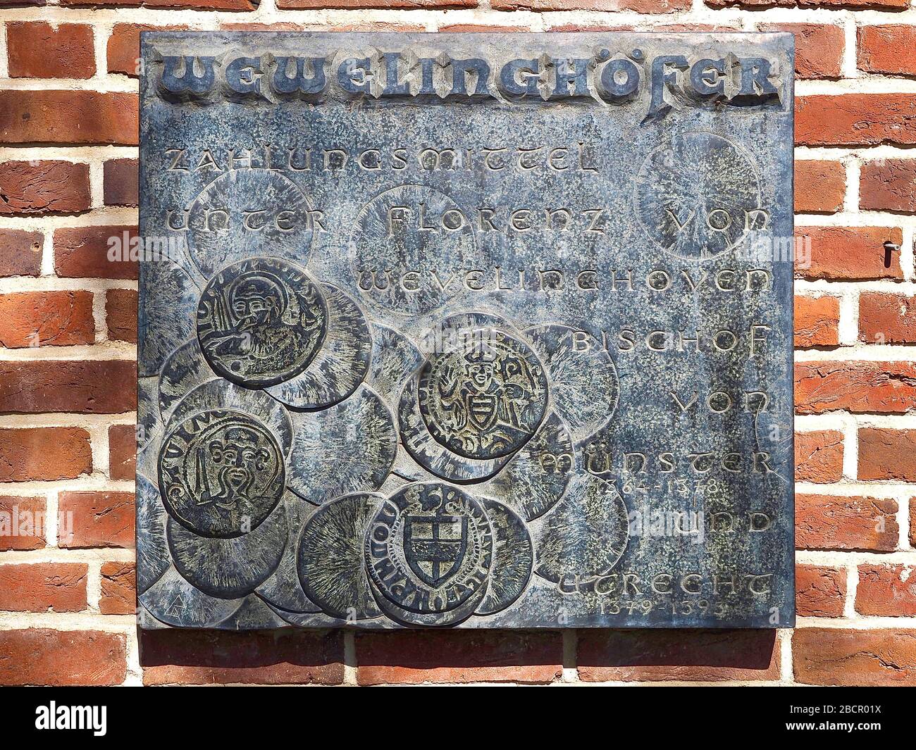 Historic coins of florence on an outside wall of a church in ...
