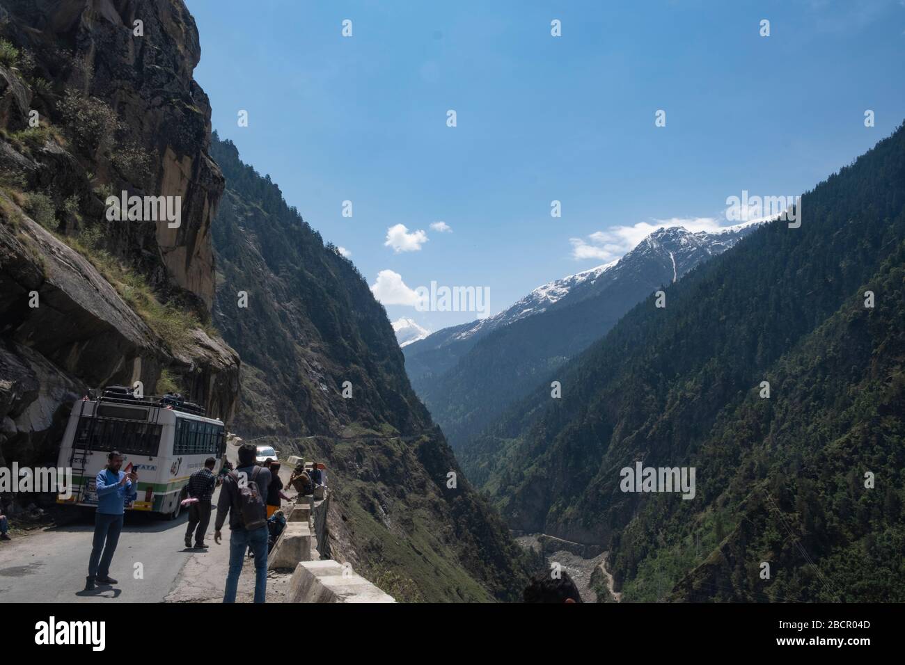 Passengers await for the next bus due to the breakdown of their bus on ...
