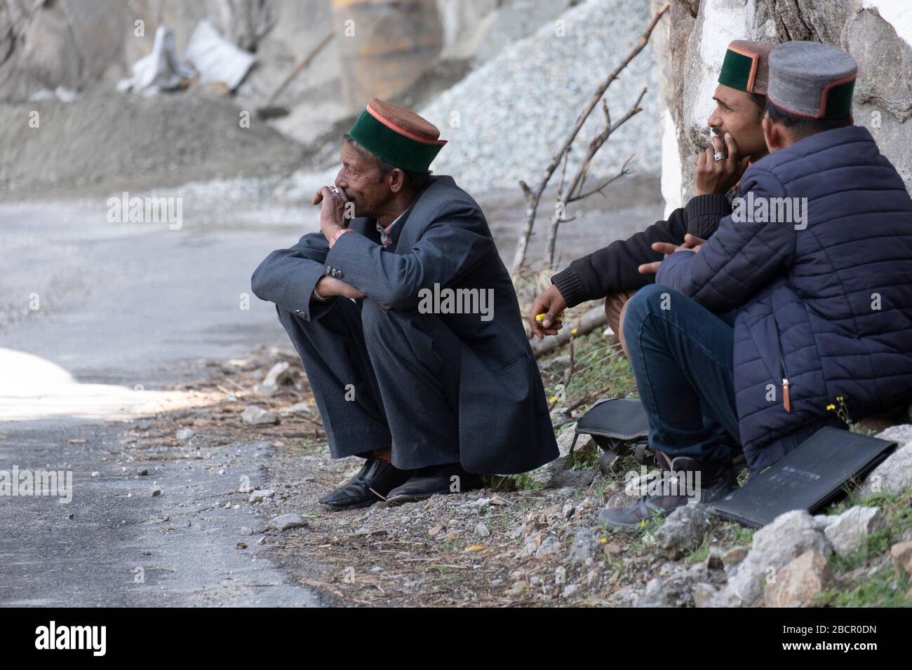 Passengers enjoy a smoke break while awaiting the next bus due to the ...